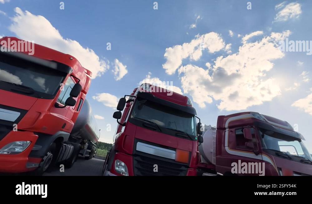Gasoline trucks stand in a row in the parking lot of the oil depot ...