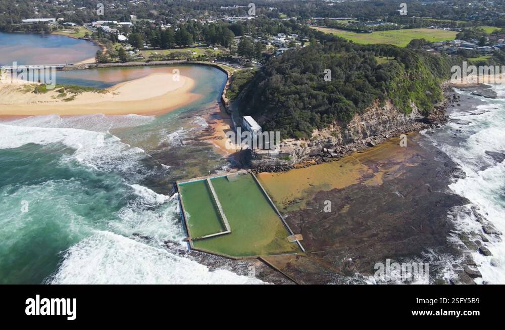 Aerial drone flyover of North Narrabeen Rock Pool at Narrabeen Beach ...