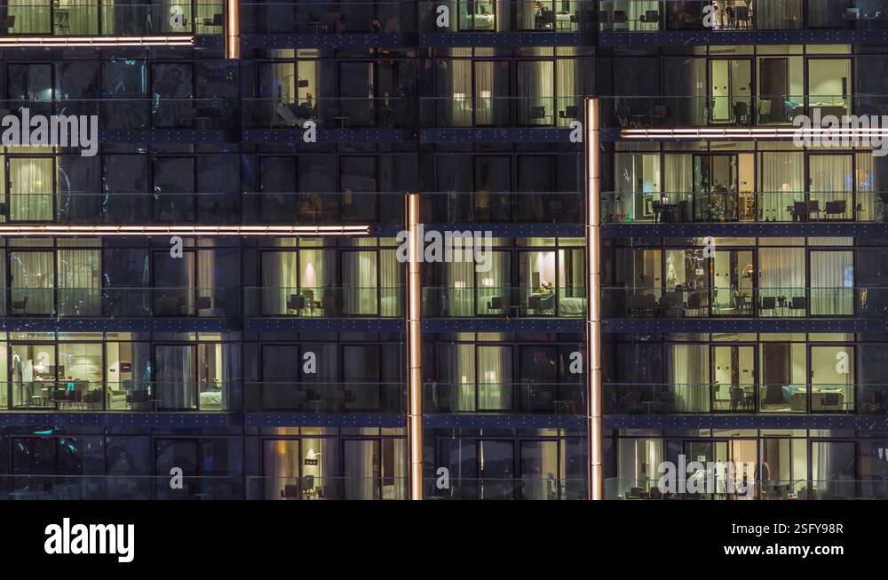 Flat night panorama of multicolor light in windows of multistory ...