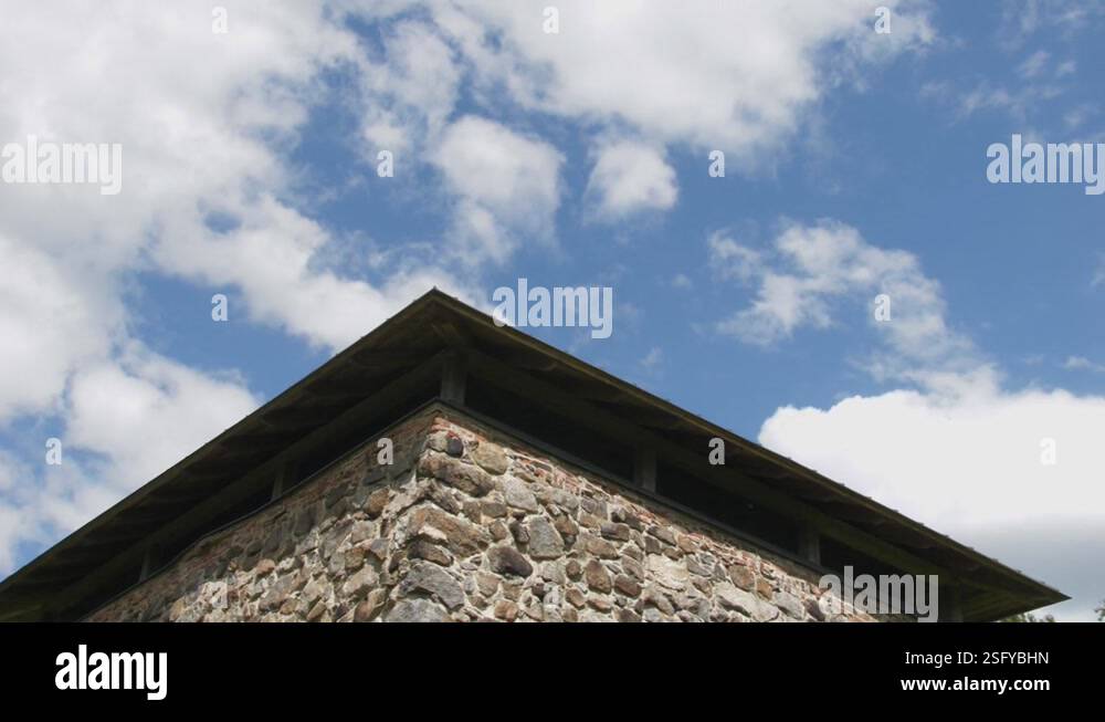 Static view of sky with moving clouds above a Nazi camp rooftop Stock ...