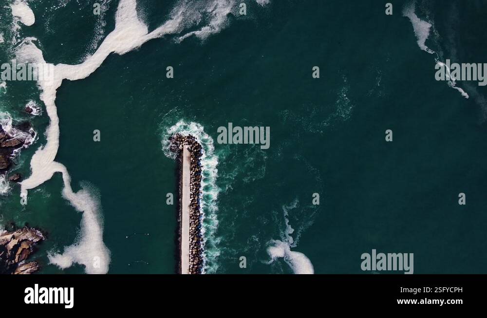 Pier runs parallel to rocky coastline, Walker Bay, Hermanus, Overstrand ...
