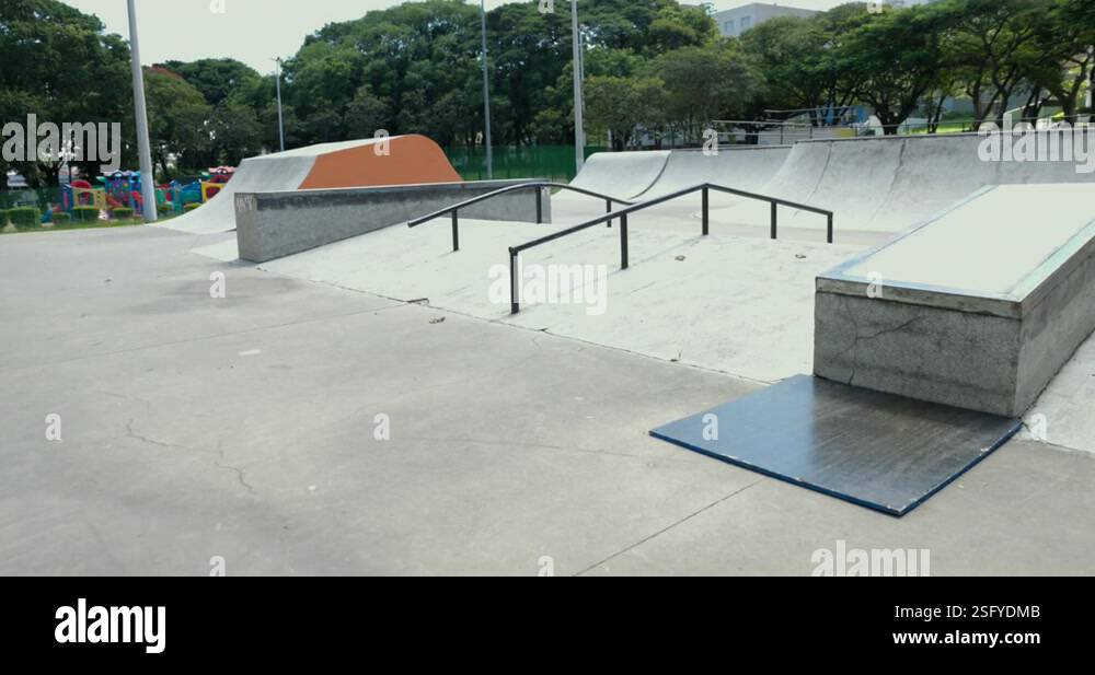 Empty skatepark on overcast summer day - wide view Stock Video Footage ...