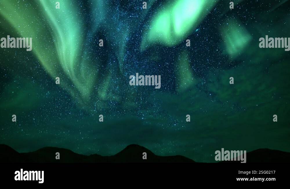 Aurora Green and Milky Way Galaxy Mountains Northeast Tilt Down Stock ...