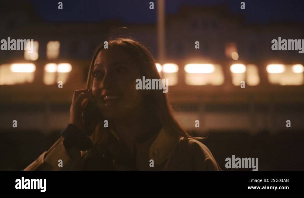 Young woman looking happy while talking on the phone Stock Video ...