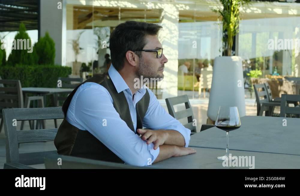 stylish sad man feeling sad alone at the table after a bad date Stock ...