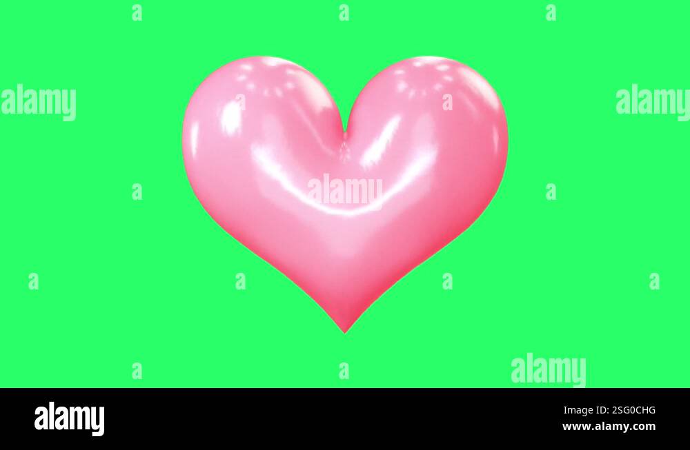 Realistic pink heart shape on green background Stock Video Footage - Alamy