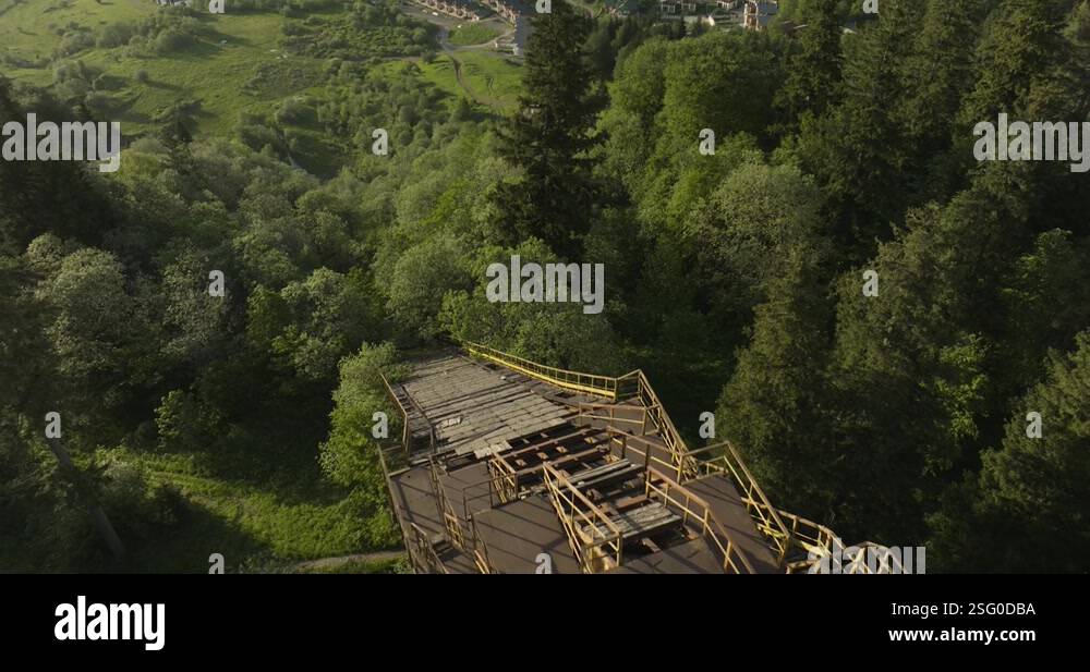 Slowly Broken-Down Ski Jump Surrounded With Lush Trees In The Forest ...