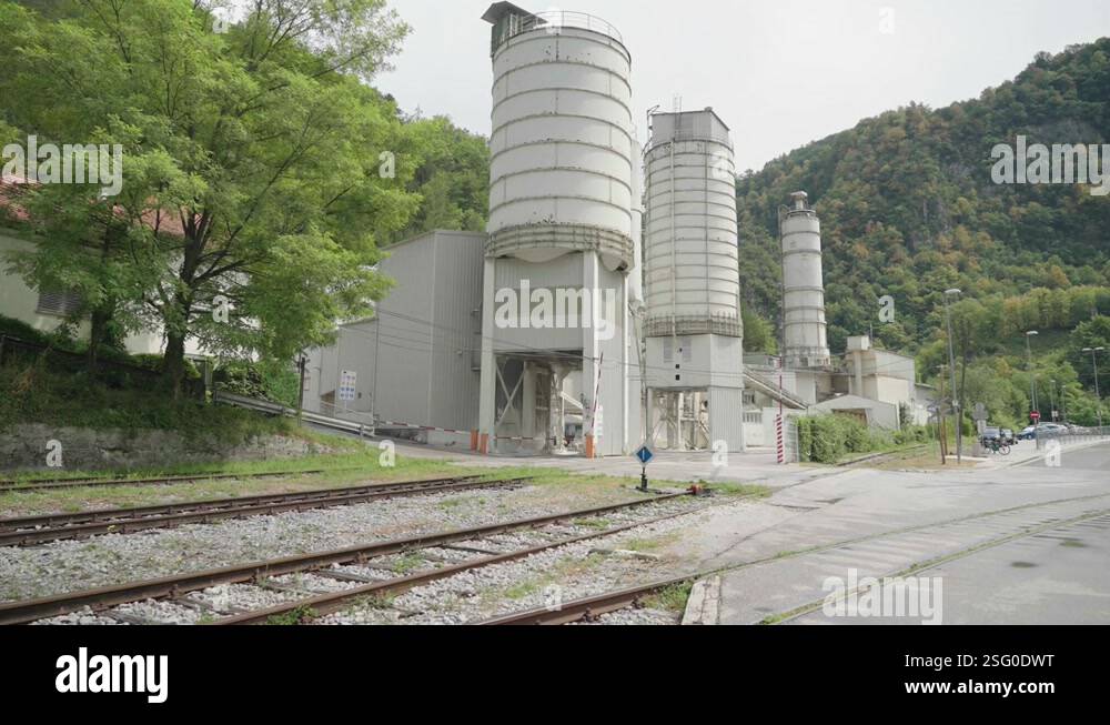 Industrial complex with silos for storing cement beside the railway 4K ...
