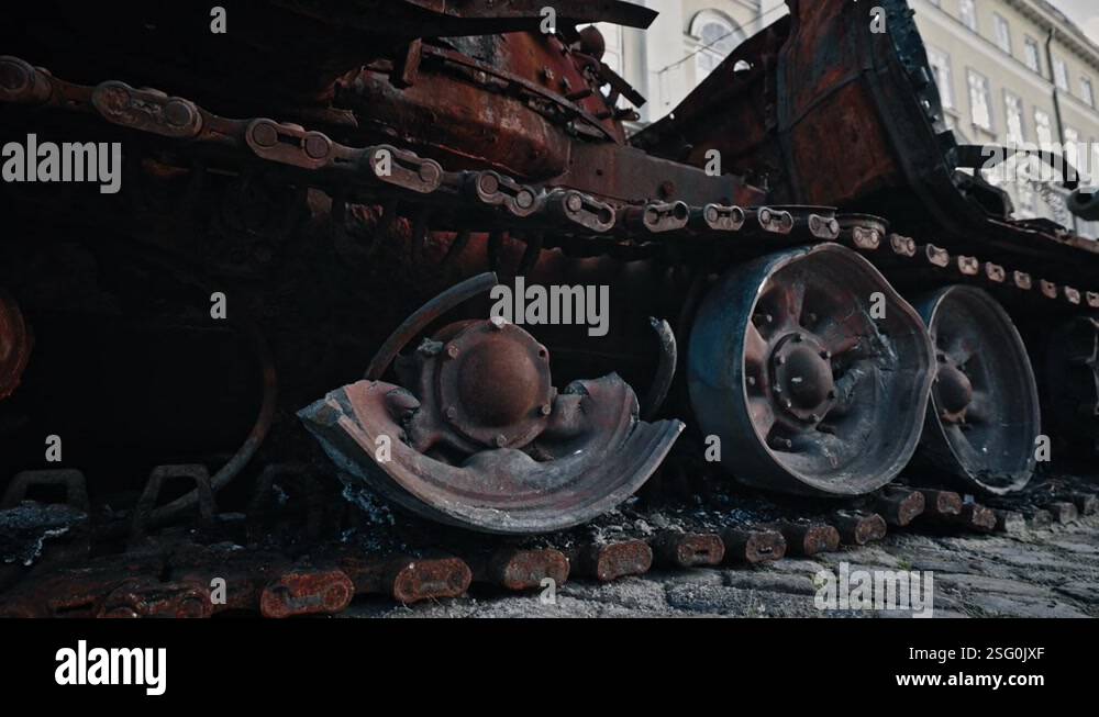 Caterpillar and wheels track of burned-out Russian tank. Close up ...
