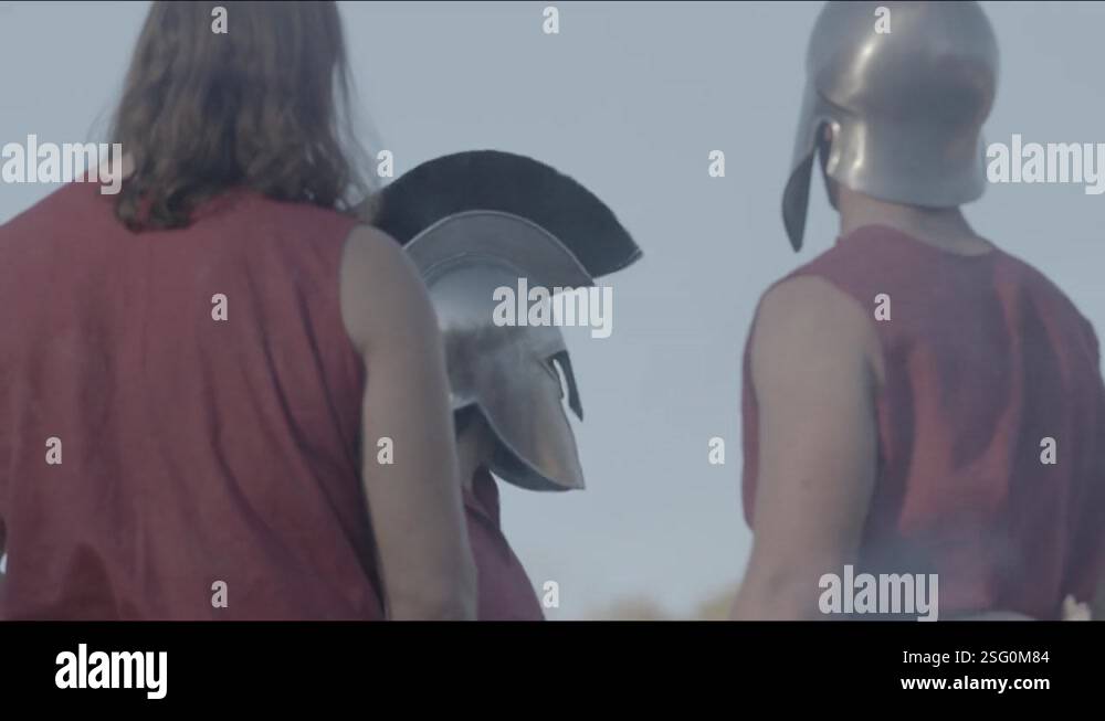 Ancient Greek Spartans in helmets and armor Salute with swords ...