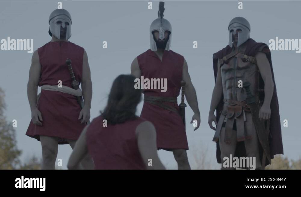 Ancient Greek Spartans in helmets and armor stand with swords ...