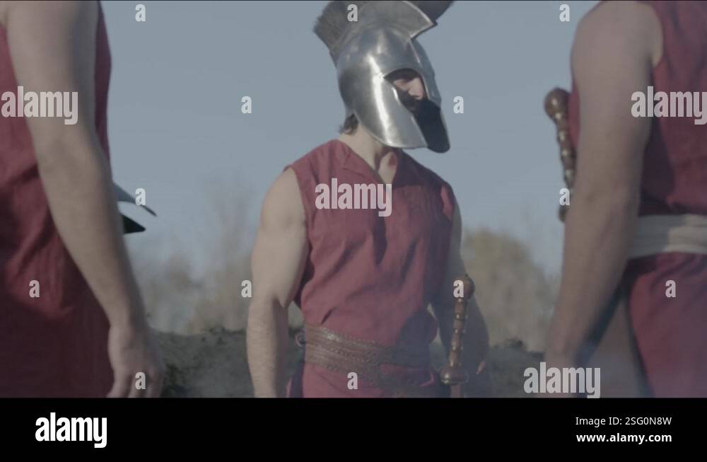 Ancient Greek Spartans in helmets and armor prepare with swords ...