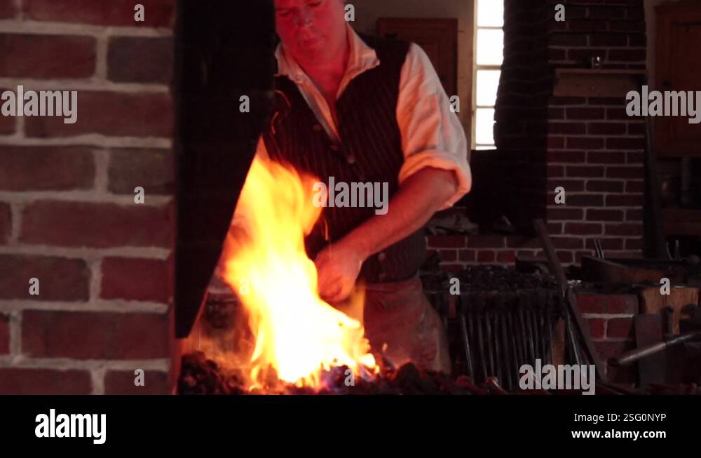 Colonial Early Century Blacksmith with Growing Fire & Flames - Works Bellows Stock Video Footage ...