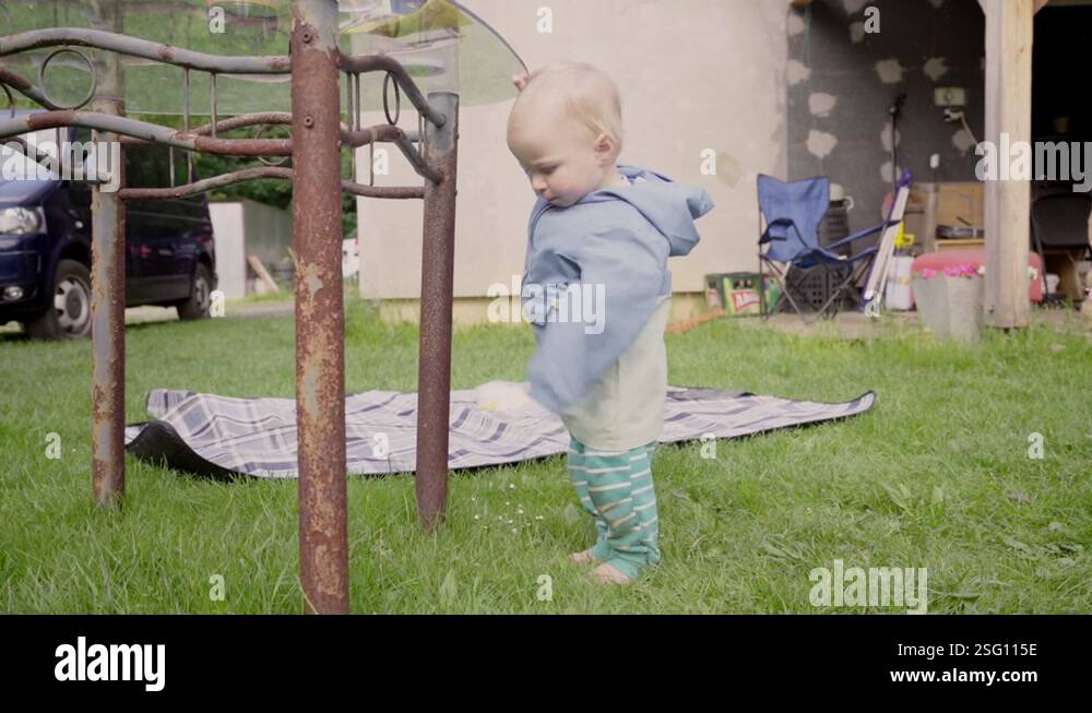 Cute Baby Boy Falling By Table On Grass In Backyard - Jablonec nad ...