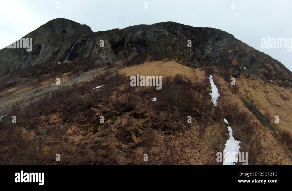 Scenic Shot Of Waterfall On Natural Rock Formation In Winter - Tromso ...