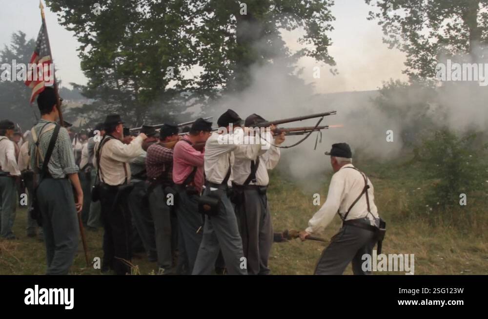 Civil War Union Re-enactors firing and fighting in battle at Sunset ...