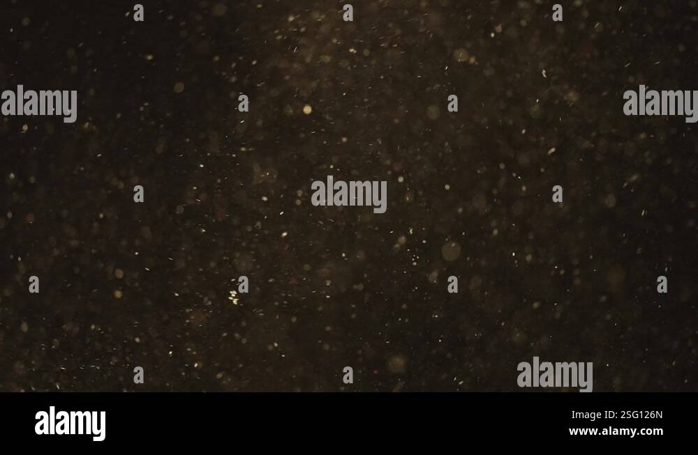 Slow motion real dust particles floating over black background Stock ...