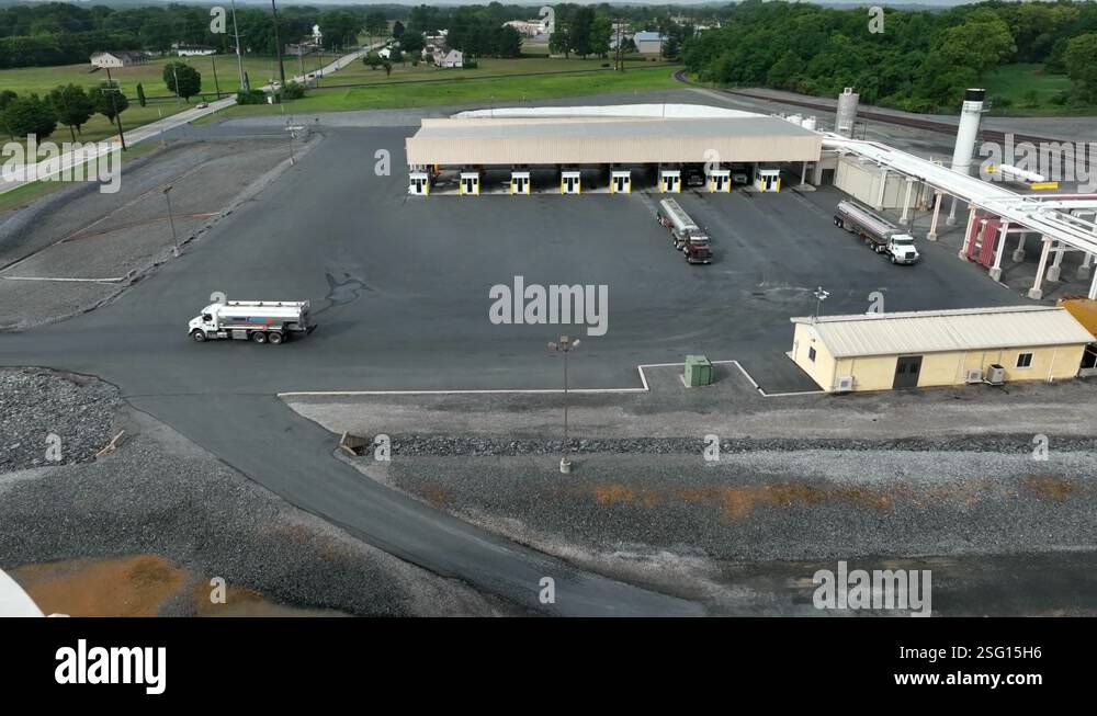 Fuel tanker trucks at gas storage terminal. Gas tanks aerial view Stock ...
