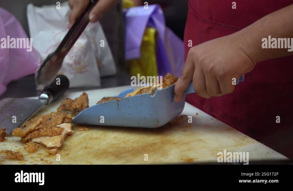 Food stall preparing takeaway order, seasoning with delicious, white ...