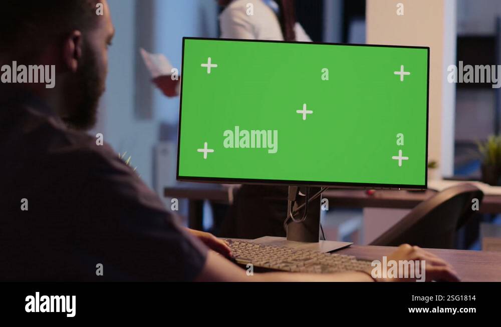 African american man looking at computer with greenscreen Stock Video ...