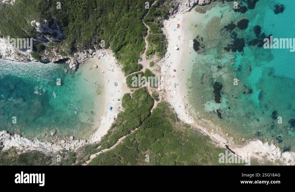 Aerial top down shot ascending to reveal a unique double beach and it's ...
