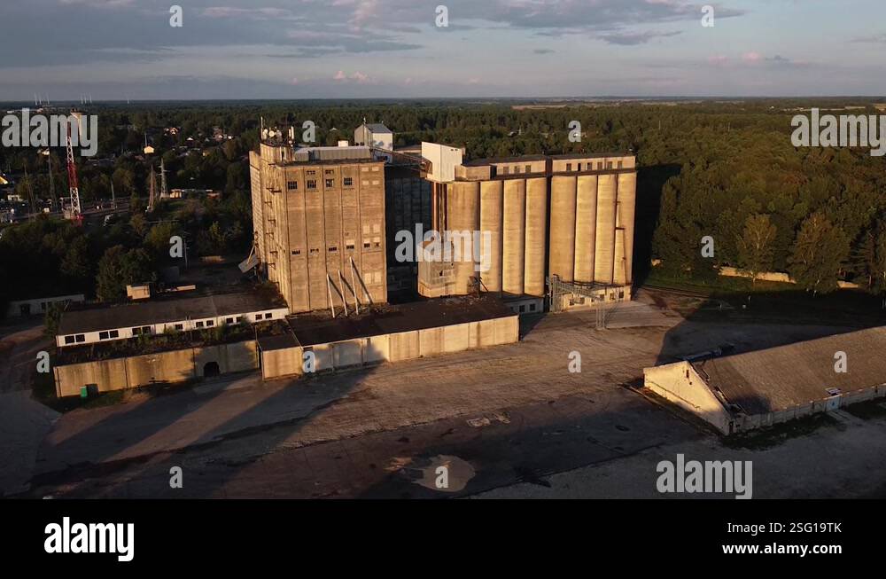 LOW to HIGH. Arial cinematic drone shot of Grain silo from Soviet Union ...