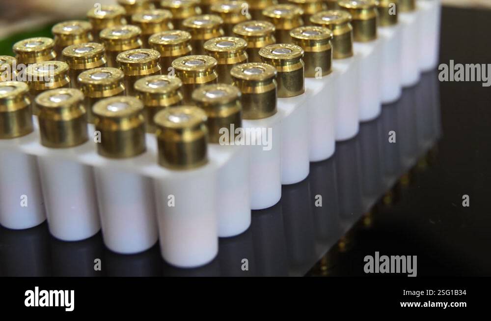 Rows in a box of 9MM bullet ammunition - turning close up Stock Video ...