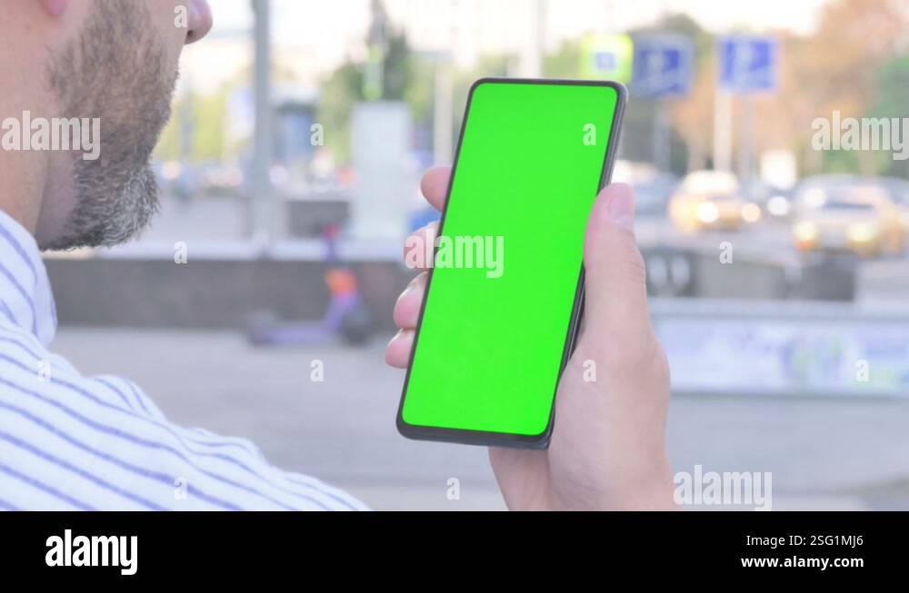 Close Up of Young Adult Man Using Smartphone with Green Screen Outdoor ...