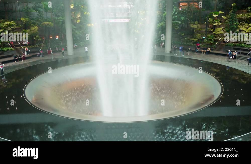 The world's tallest indoor waterfall, the Rain Vortex, surrounded by a ...