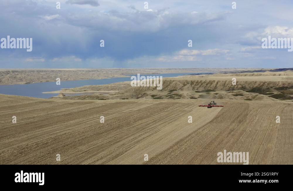 Seeding of vast farm land in Saskatchewan, Canada - aerial perspective ...