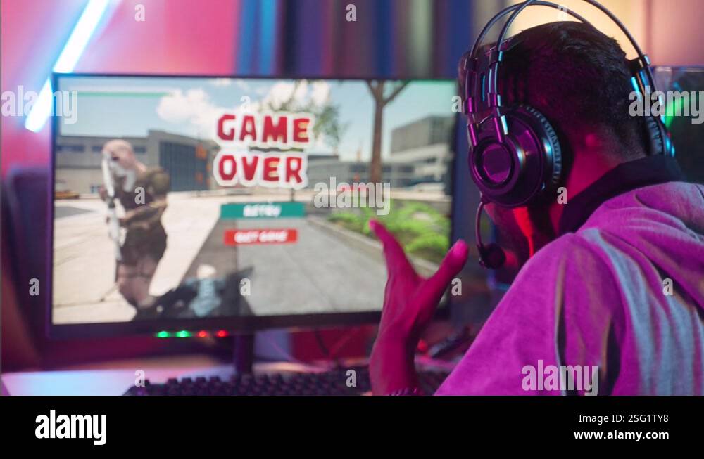 shoulder shot of sad or frustrated gamer due to loss while playing ...