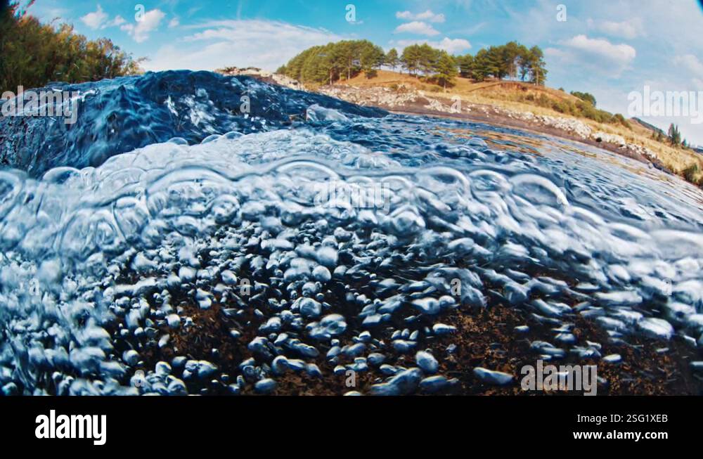 Rapid river split. Splitted view of the clean rapid river flowing in ...