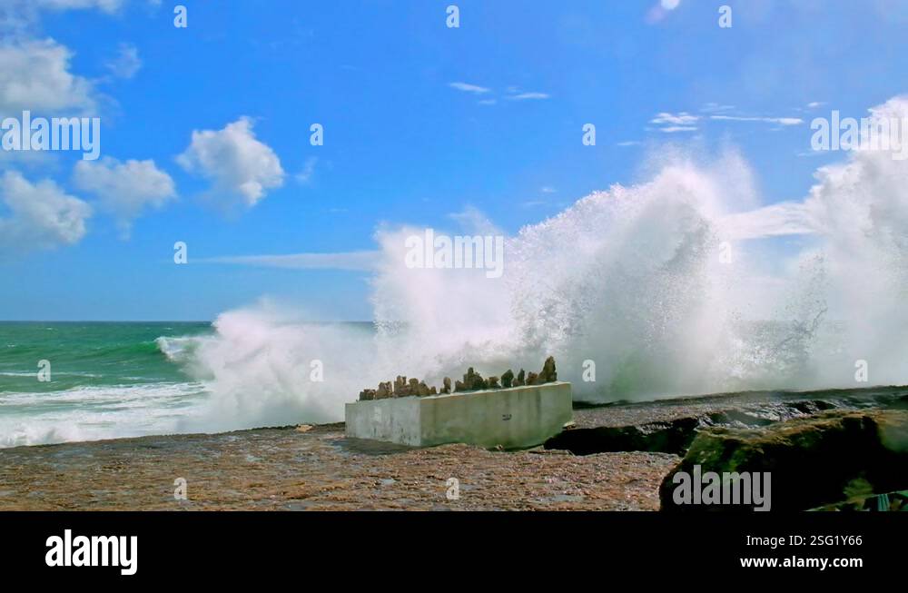 Large ocean waves crash about the pier. Slow motion - ocean waves ...