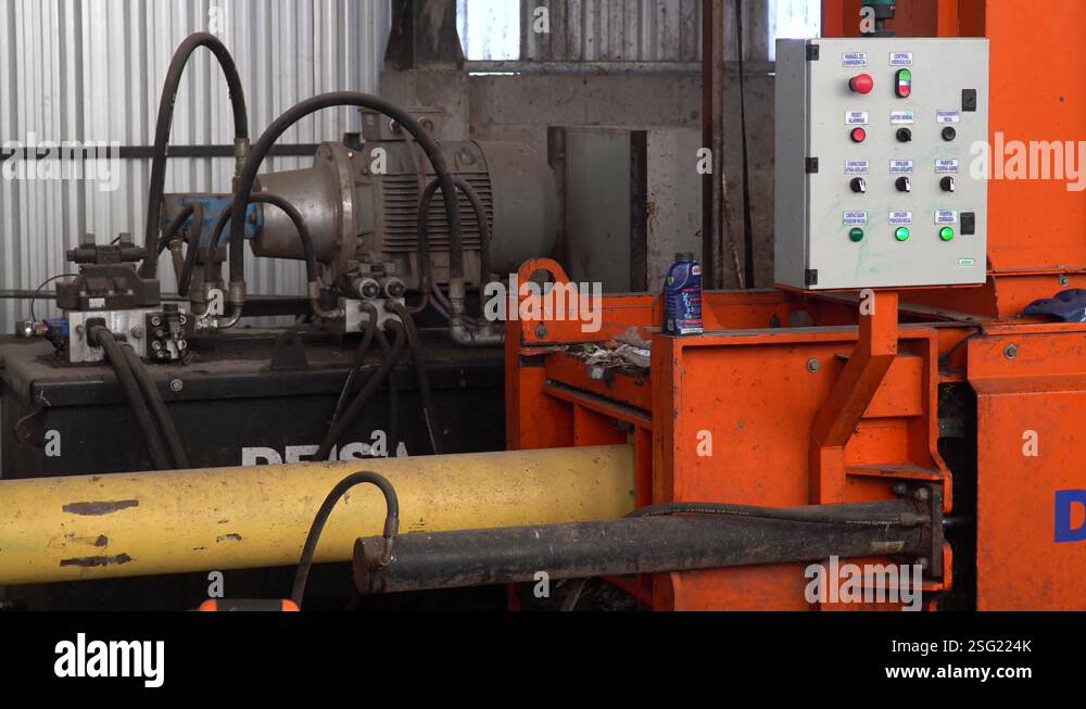 Close view of a waste compactor machine at work inside a waste ...