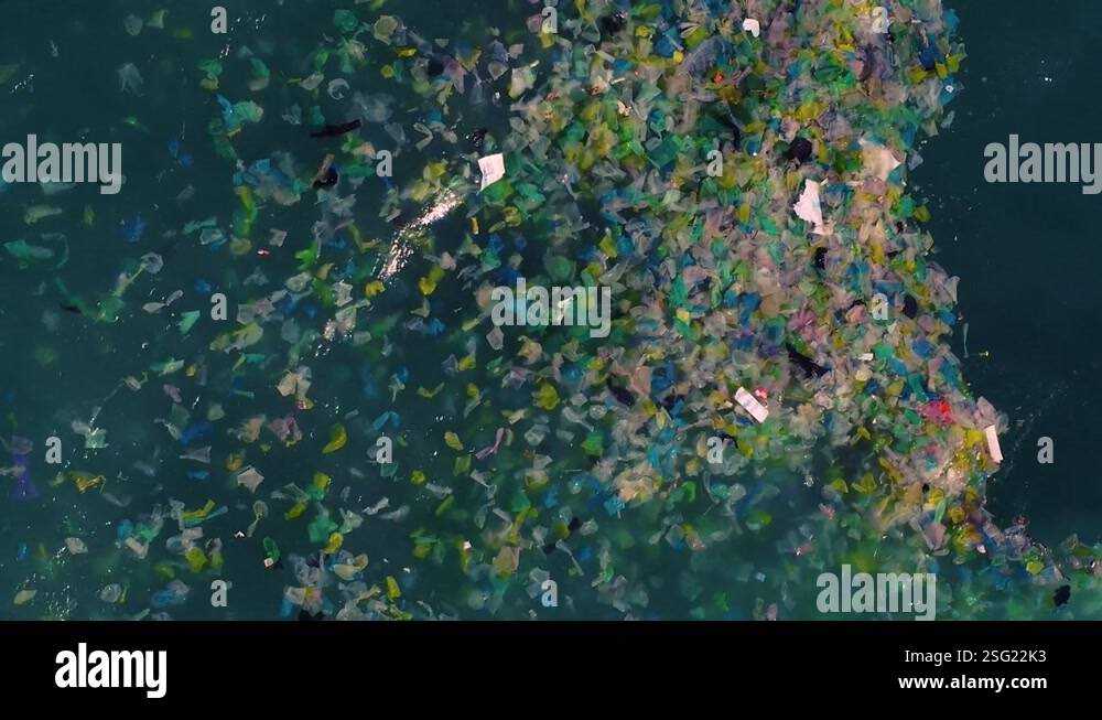 Polluted plastic bags floating on ocean surface. Aerial top down Stock ...