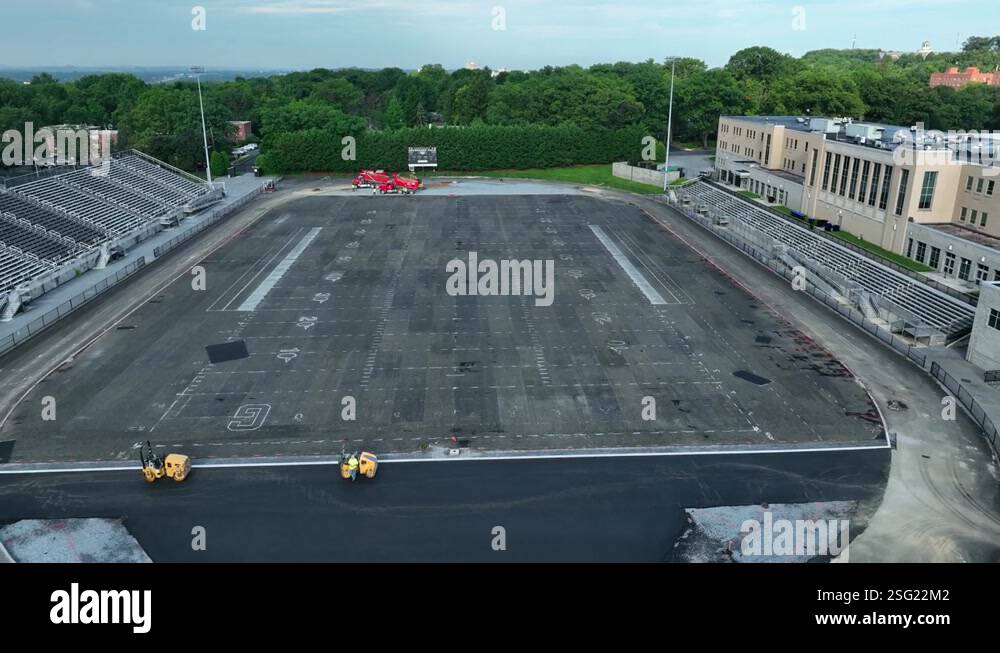 Old football field on school campus. Under construction and torn apart ...