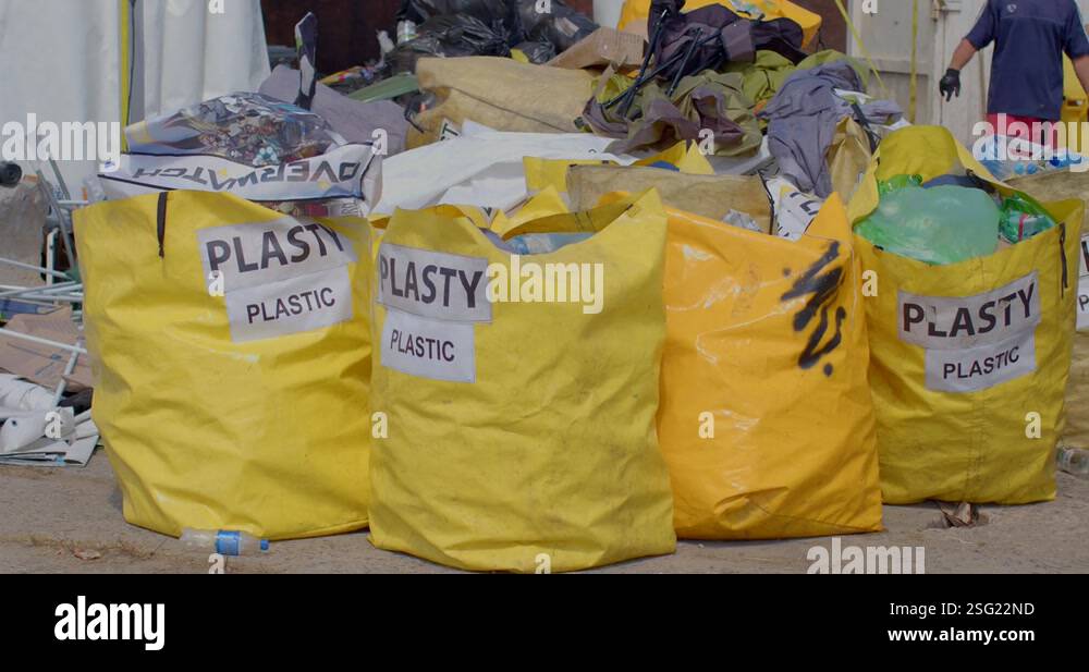 Sorting garbage at mobile waste sorting point. Plastic recycling in ...