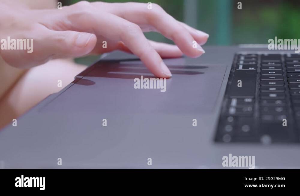 Close up female hands type on laptop keyboard touching touchpad with ...