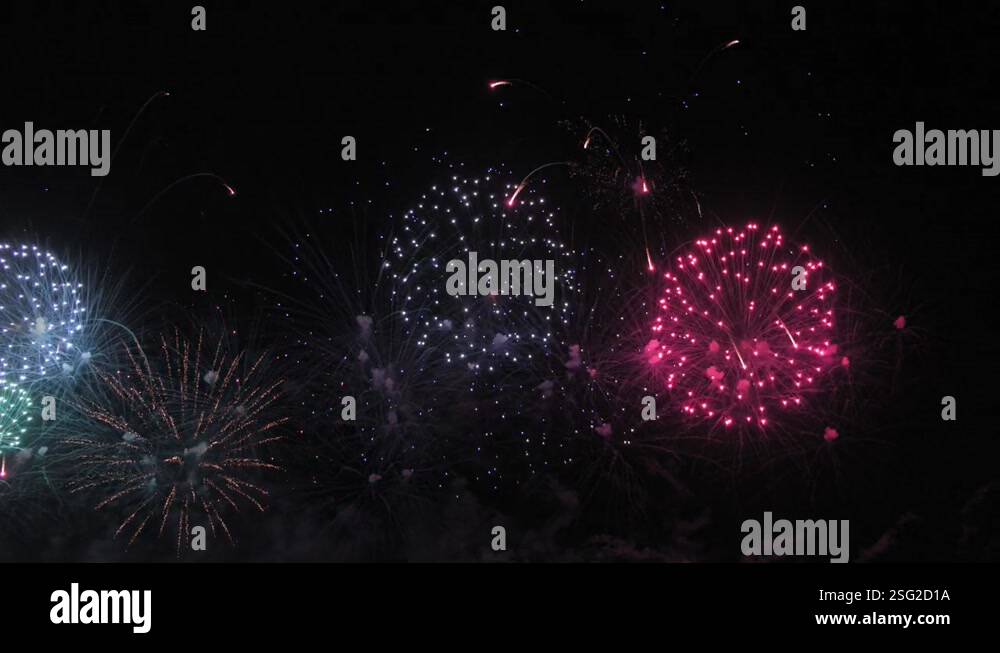 A cannonade of fireworks explosions in the night sky at fireworks festival Stock Video Footage ...