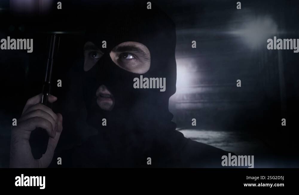 Masked man gun Stock Videos & Footage - HD and 4K Video Clips - Alamy