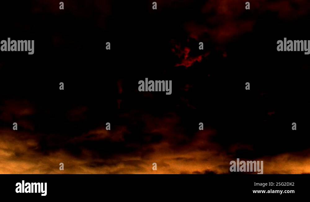 Time laps. Terrible bloody clouds fly across the dark sky. Terrible ...