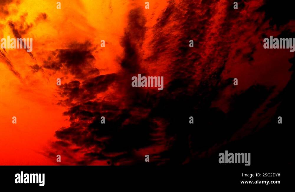 Time laps. Terrible bloody clouds fly across the dark sky. Terrible ...