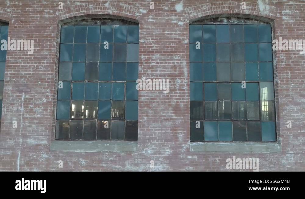 Old abandoned cotton mill warehouse with sunlight filling the empty ...