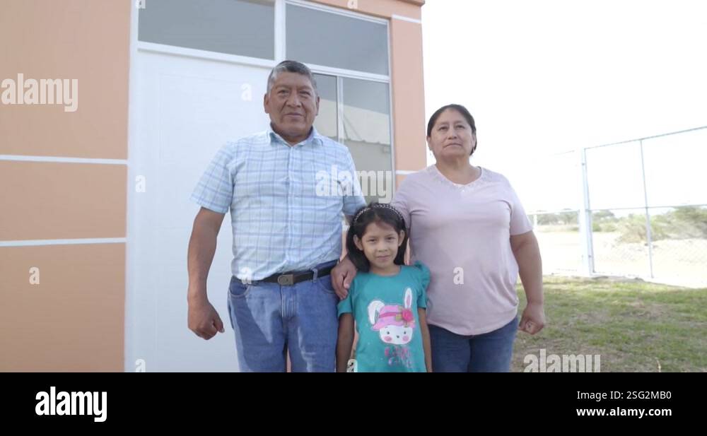 Peruvian family made up of father, mother and daughter, pose smiling in ...