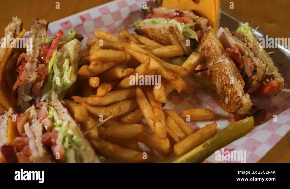 Club sandwich cut into four squares with fries, slider 4K Stock Video ...