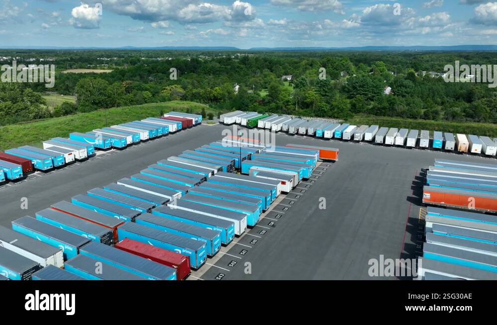 Amazon trailers parked at distribution center. Package delivery service ...