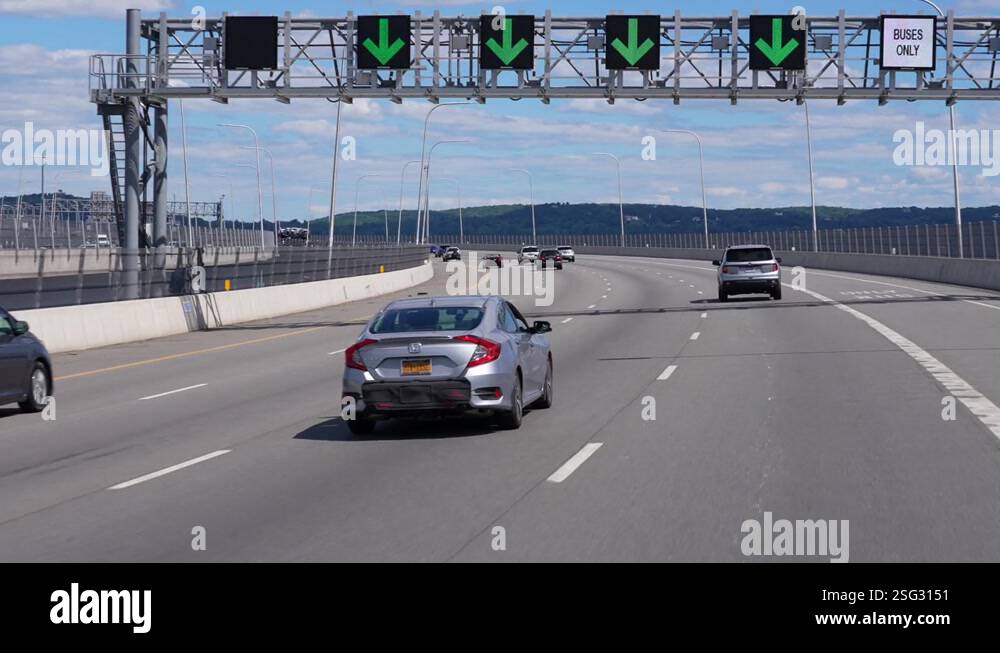 Cars drive on toll interstate bridge. New Gov Mario Cuomo bridge Tappan ...