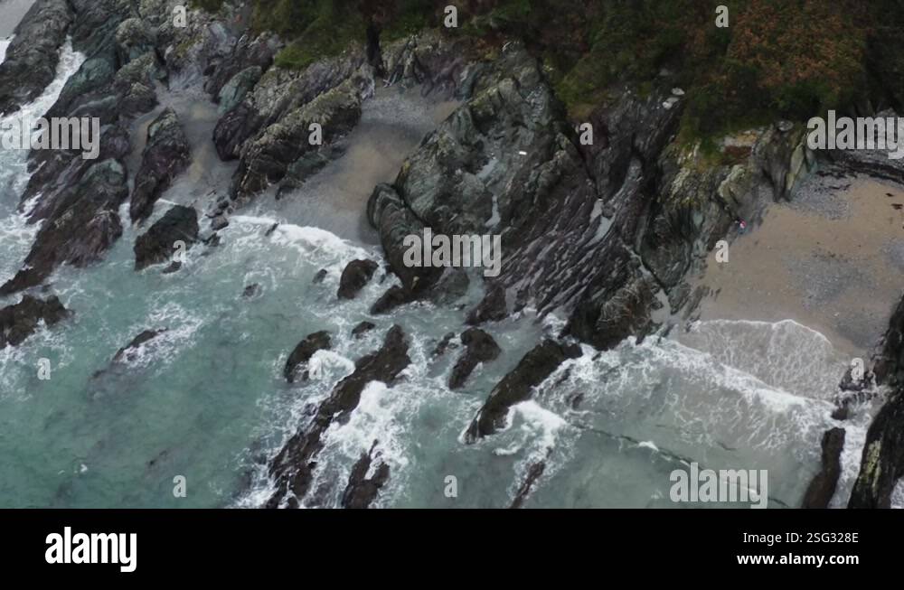 Surfing Waves Hit On The Rugged Seacoast Of Polhawn Fort In Torpoint ...