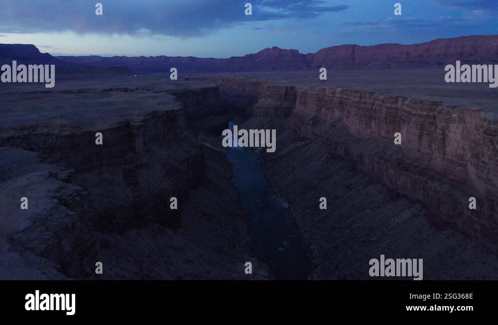 Aerial flyover Marble Canyon, red rock cliffs of Arizona during dusk ...
