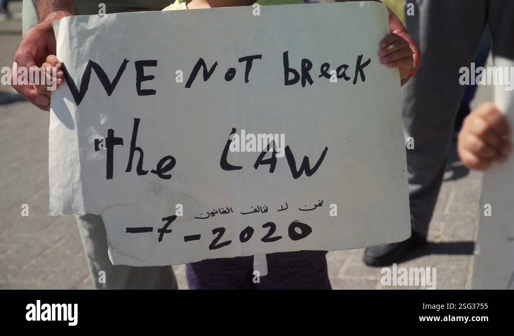 Asylum Seekers Child Showing A Protest Sign Due To Long Waiting Times ...
